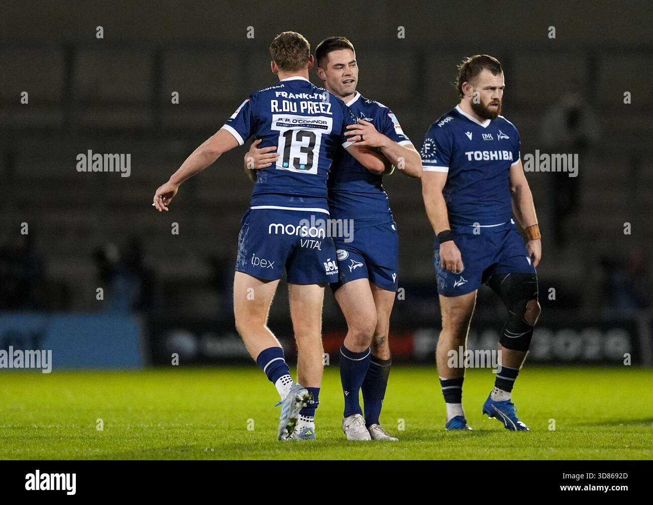 Sale Sharks' Luke James (centre) celebrates his try with team-mate Rob ...