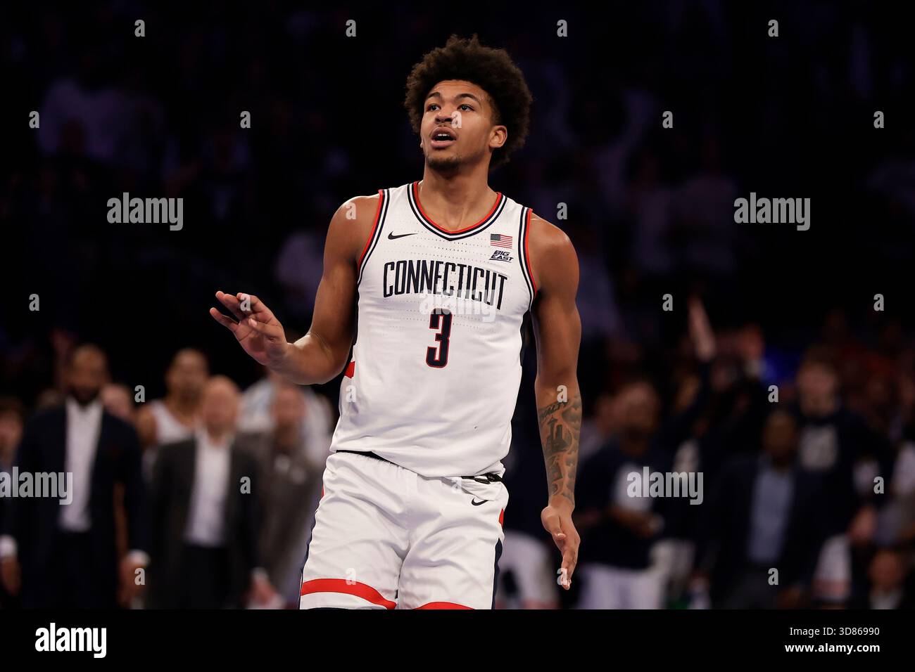UConn forward Jaylin Stewart (3) reacts during the first half of an ...