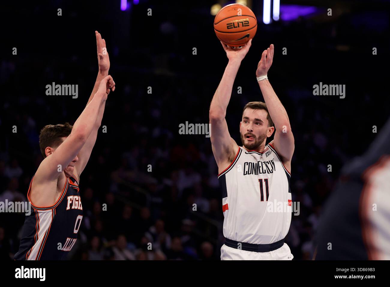 UConn forward Alex Karaban (11) shoots during the first half of an NCAA ...