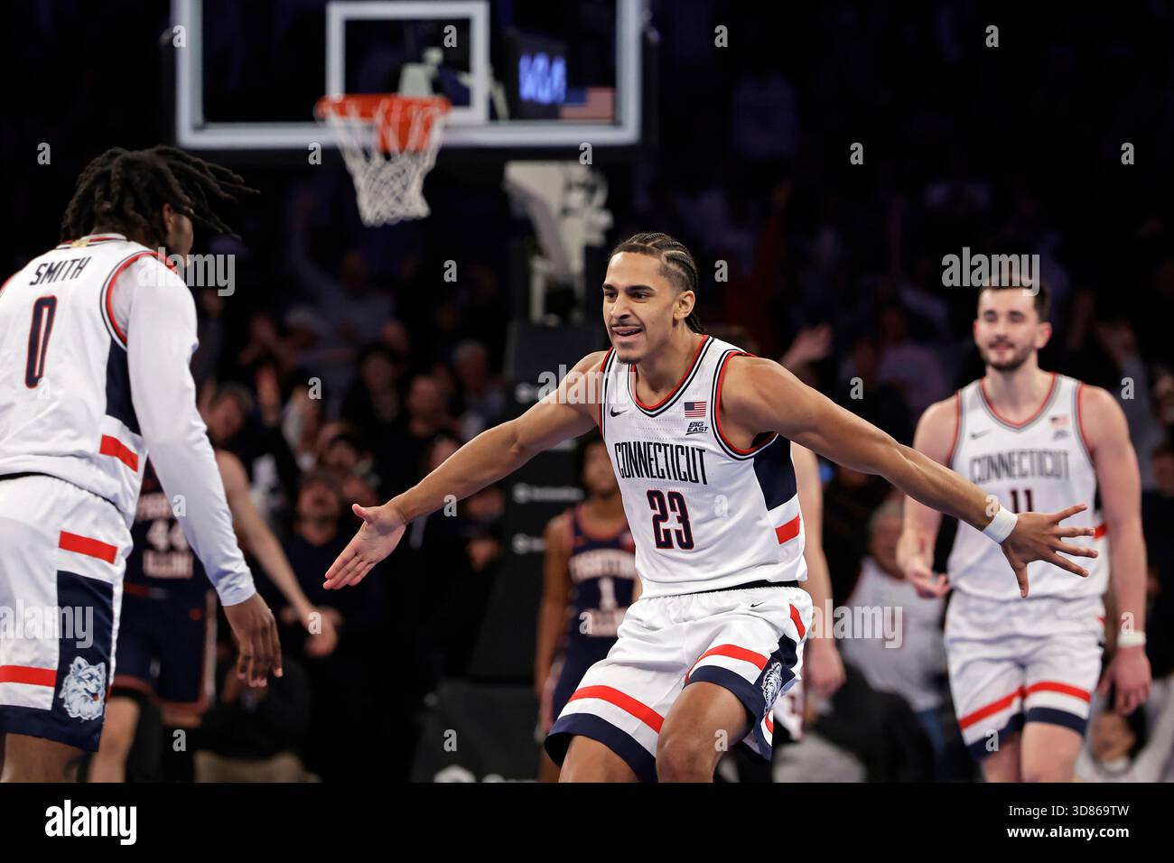 UConn forward Jayden Ross (23) reacts after making a three-point basket ...