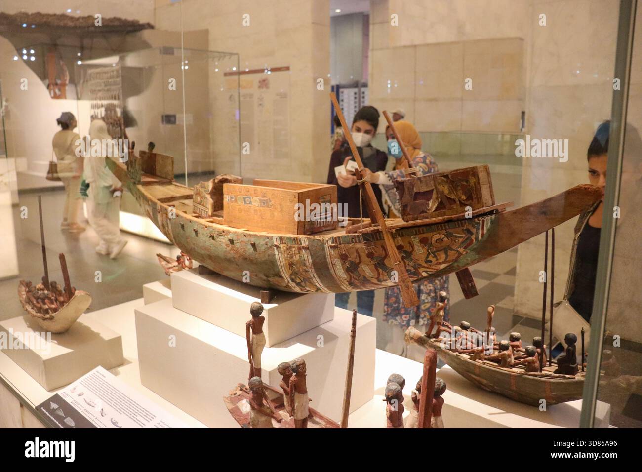 Painted wooden model of an ancient Egyptian funerary boat with crew ...
