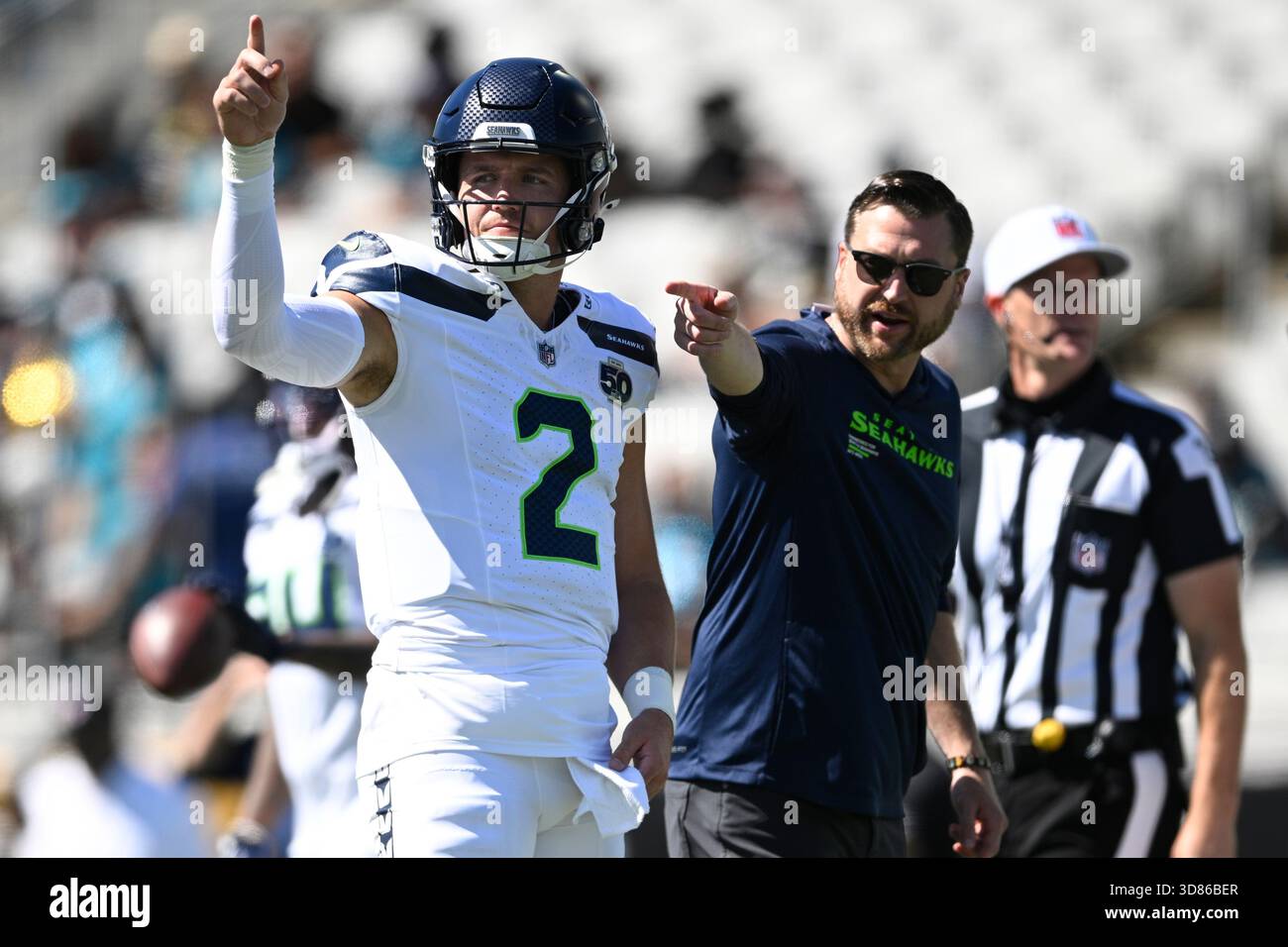 Seattle Seahawks quarterbacks coach Andrew Janocko, center, and ...