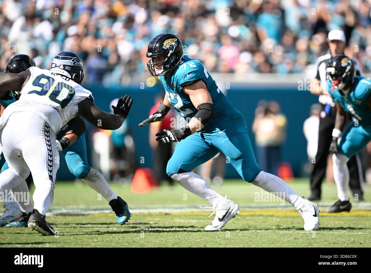 Jacksonville Jaguars offensive tackle Walker Little (72) sets up to ...