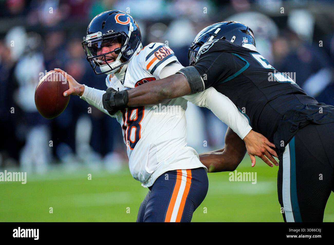 Philadelphia Eagles linebacker Jalyx Hunt (58), right, pressures ...