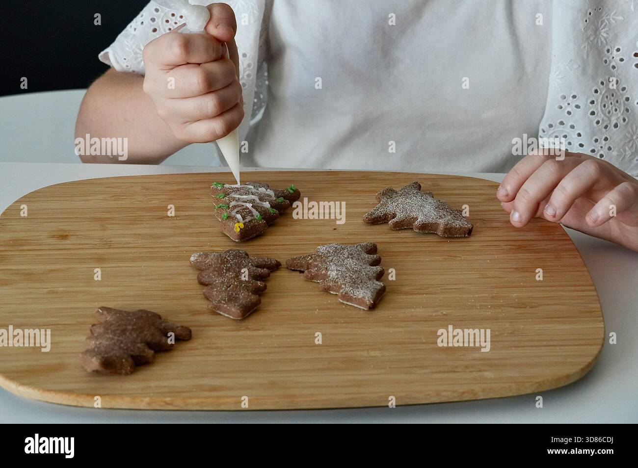 Children gingerbread childrens hands hi-res stock photography and ...