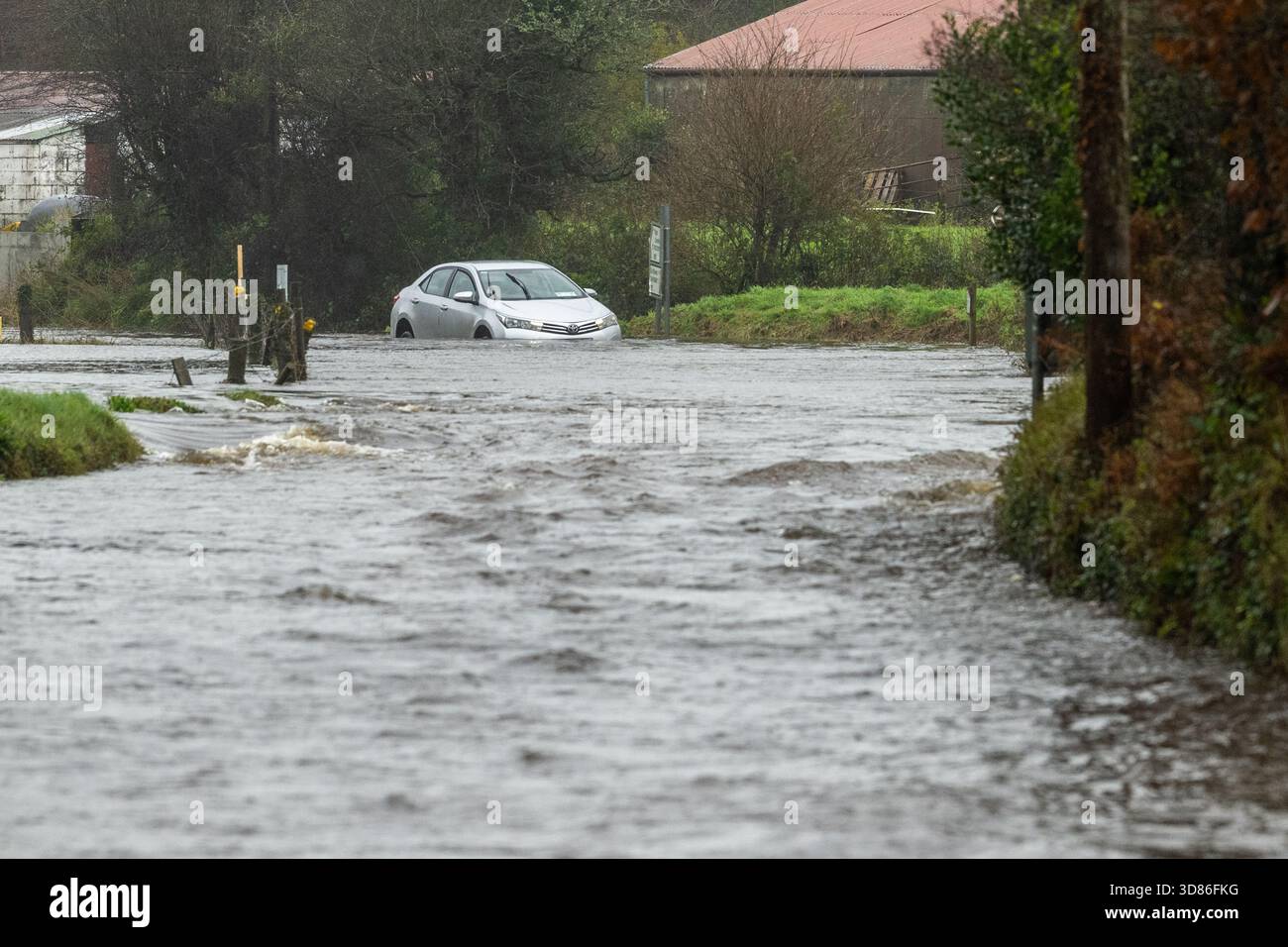 Storm Bert rain floods the R587 at Ardcahan Bridge, West Cork, Ireland ...