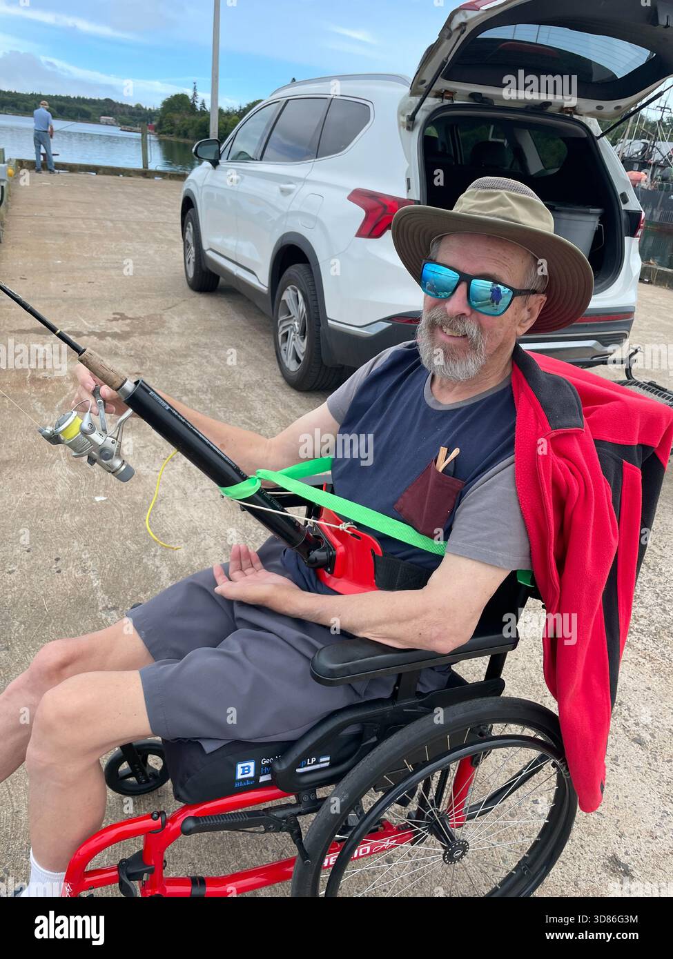 Person disabled fishing wheelchair hi-res stock photography and images ...