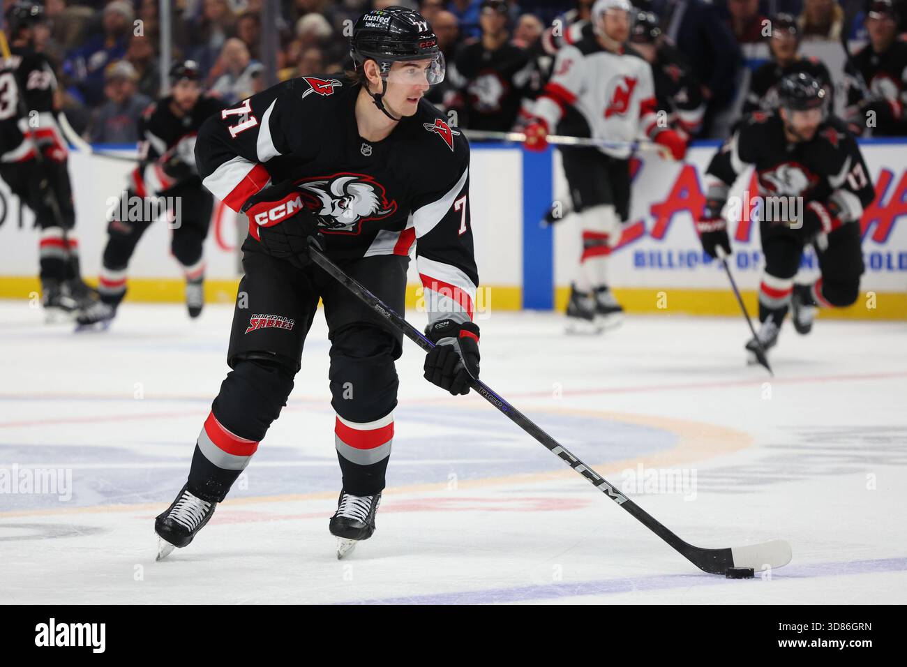 Buffalo Sabres center Ryan McLeod (71) brings the puck over the blue ...