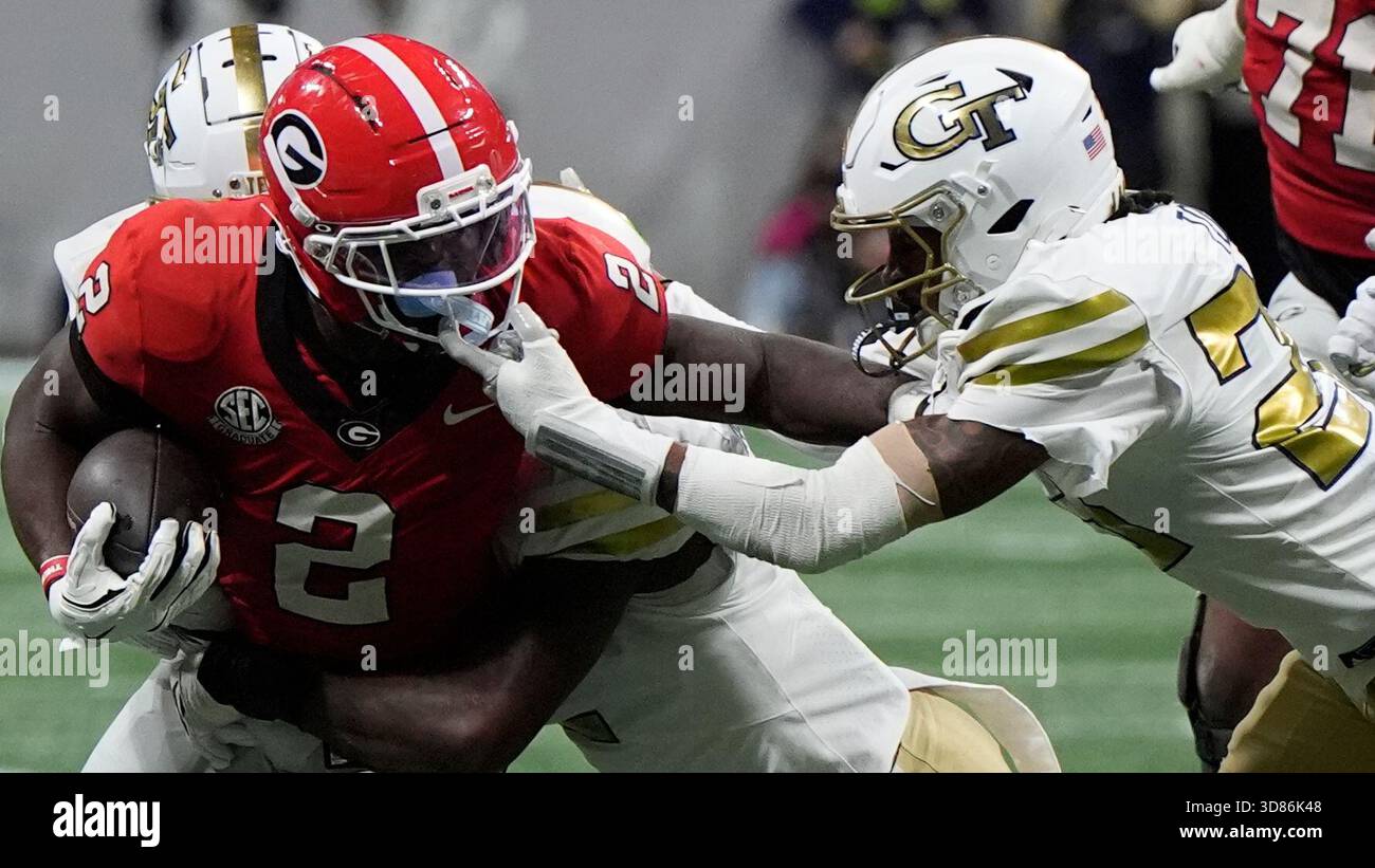 Georgia Tech defensive back Zachary Tobe (23) tackles Georgia running ...