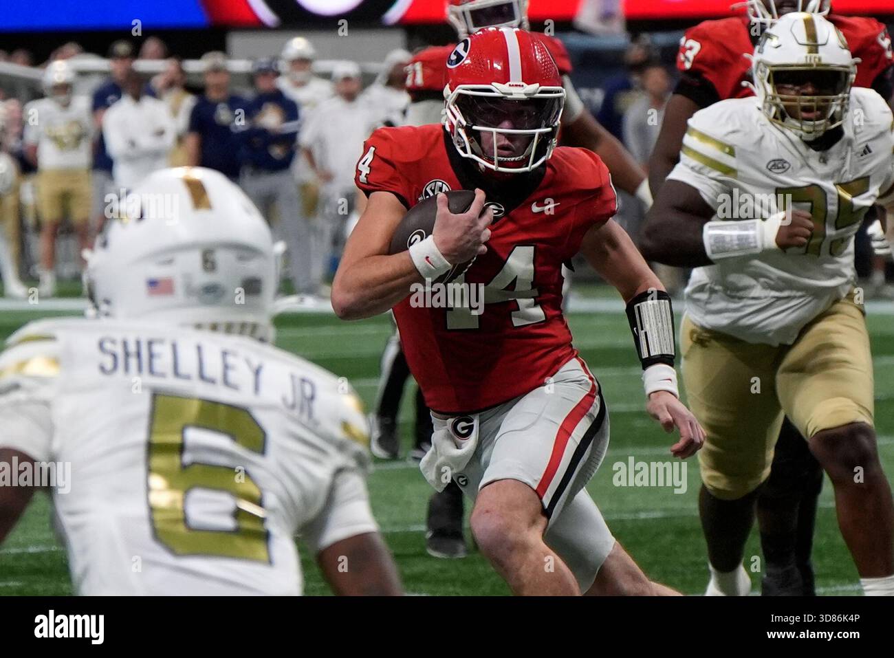 Georgia quarterback Gunner Stockton (14) runs against Georgia Tech ...
