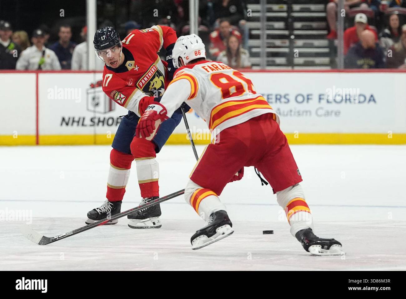 Florida Panthers center Evan Rodrigues (17) passes around Calgary ...