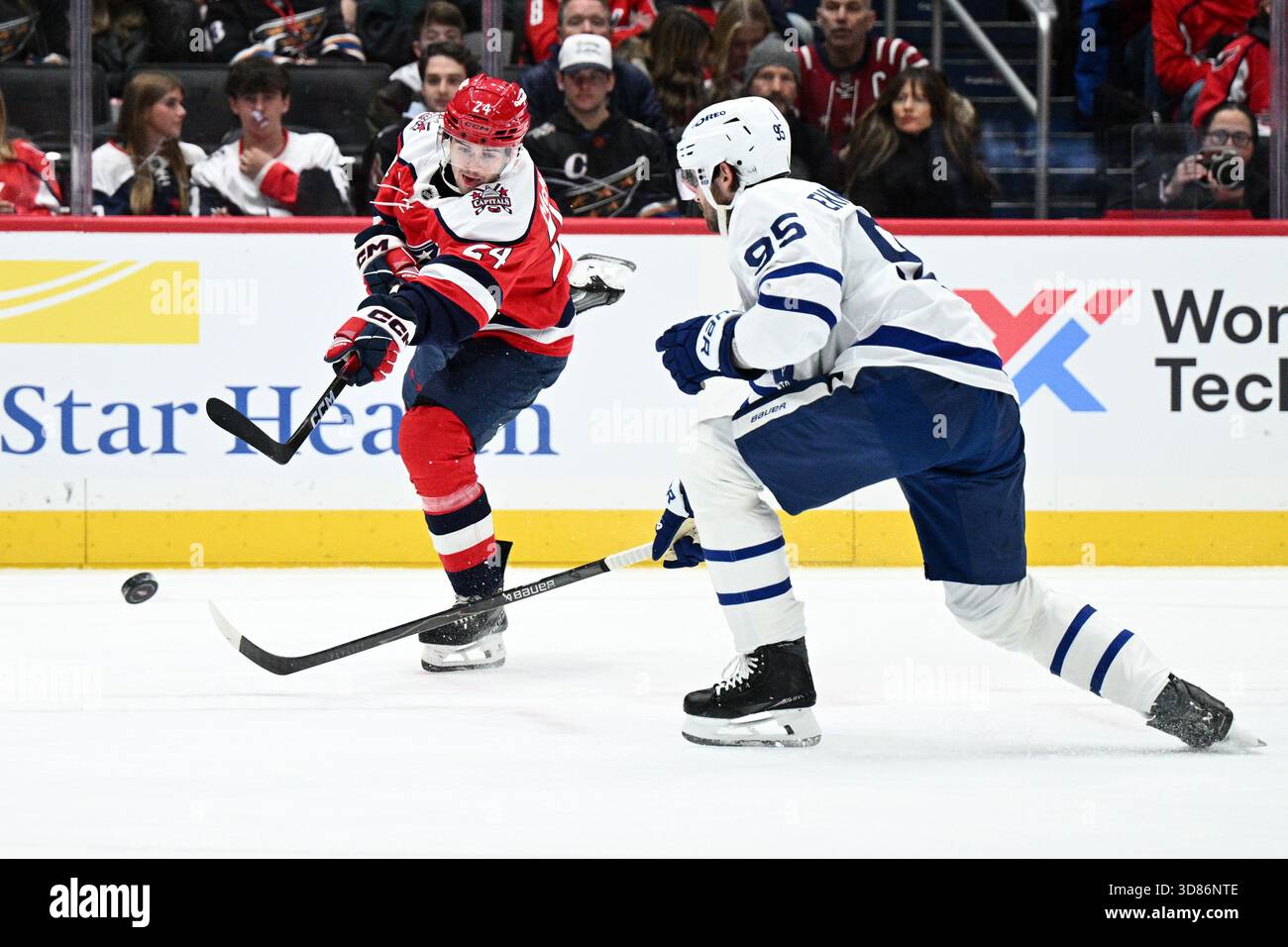 Washington Capitals center Connor McMichael (24) shoots the puck ...