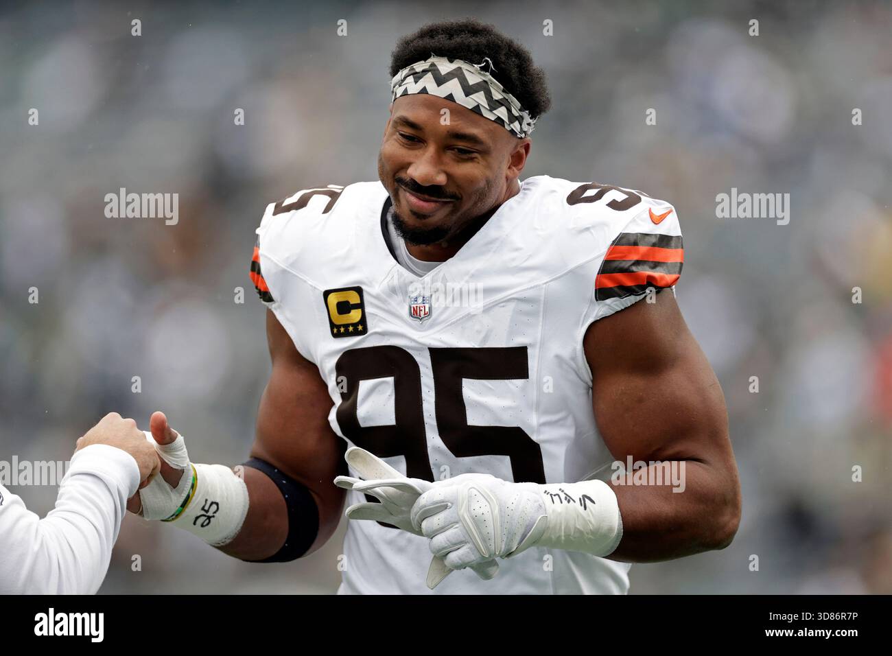 FILE - Cleveland Browns defensive end Myles Garrett warms up before an ...