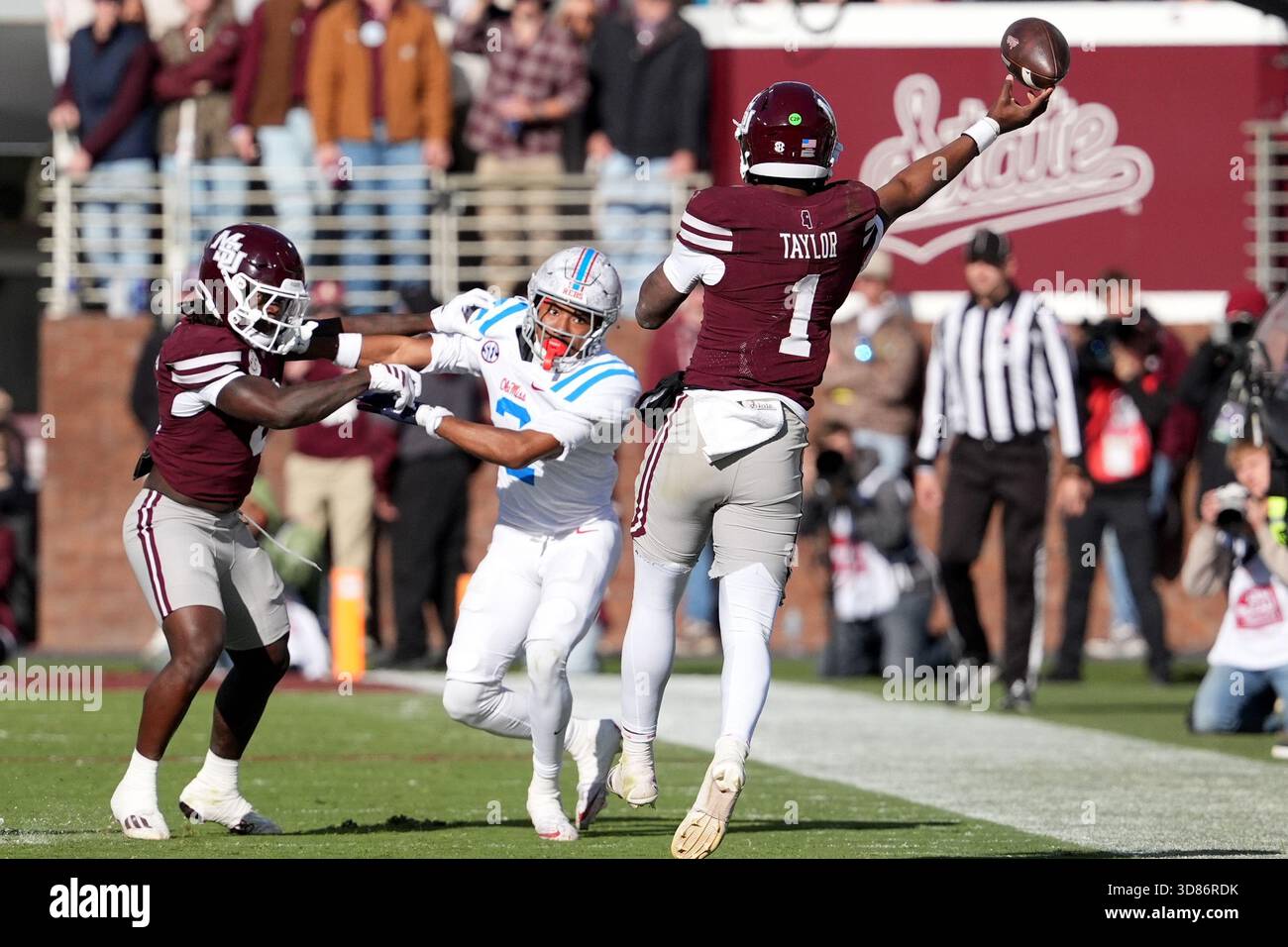 Mississippi State quarterback Kamario Taylor (1) attempts to pass over ...