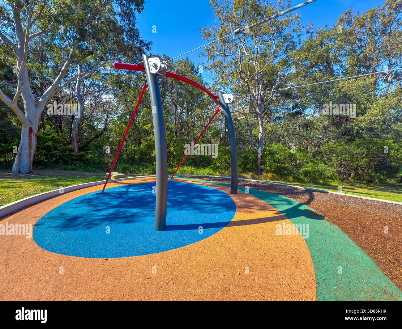 Photograph of playground equipment surrounded by lush foliage in ...