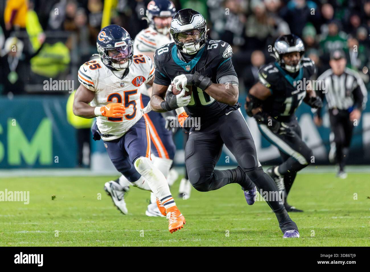 Philadelphia Eagles linebacker Jalyx Hunt (58) carries an interception ...