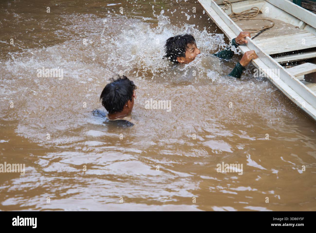 Local young people swim at the Mekong river in Luang Prabang, Laos ...