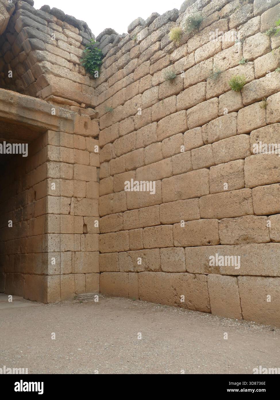 MYCENAE, GREECE - MAY 15, 2025 - Massive stone walls intersecting at ...