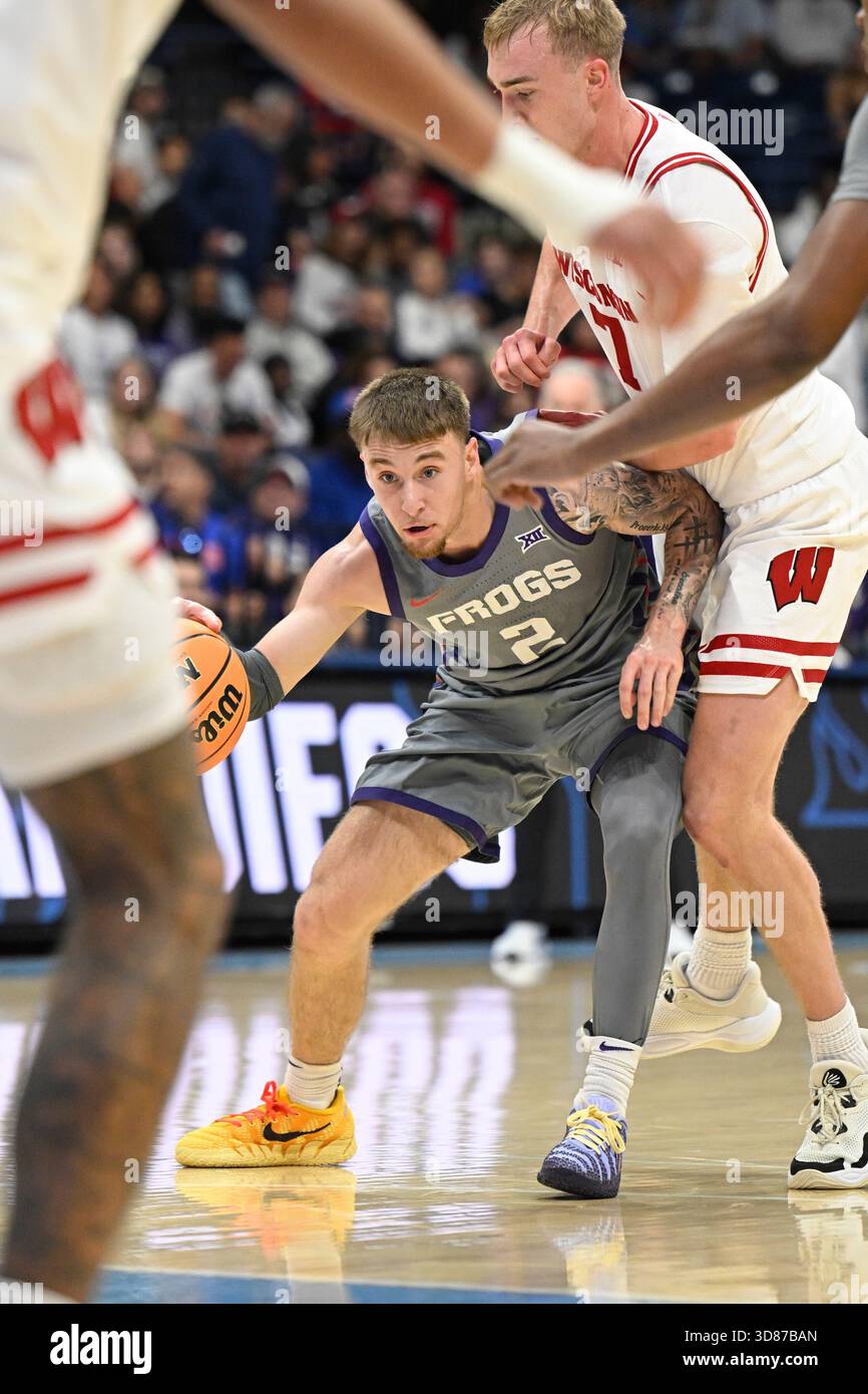 TCU guard Brock Harding (2) is guarded by Wisconsin guard Andrew Rohde ...