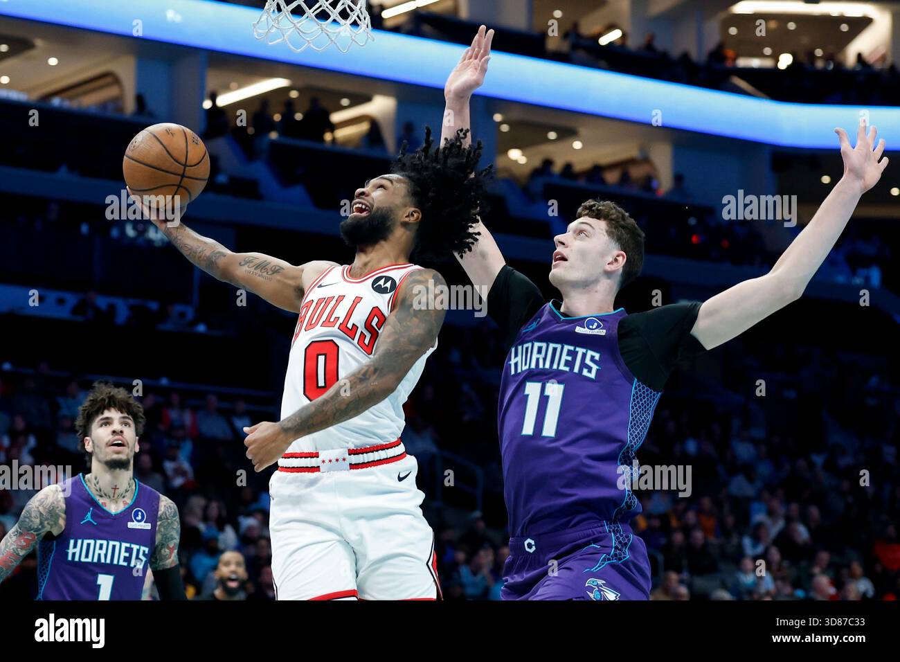 Chicago Bulls guard Coby White (0) drives to the basket against ...