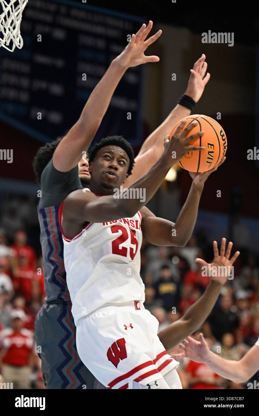 Wisconsin guard John Blackwell (25) shoots past TCU guard Jace Posey ...