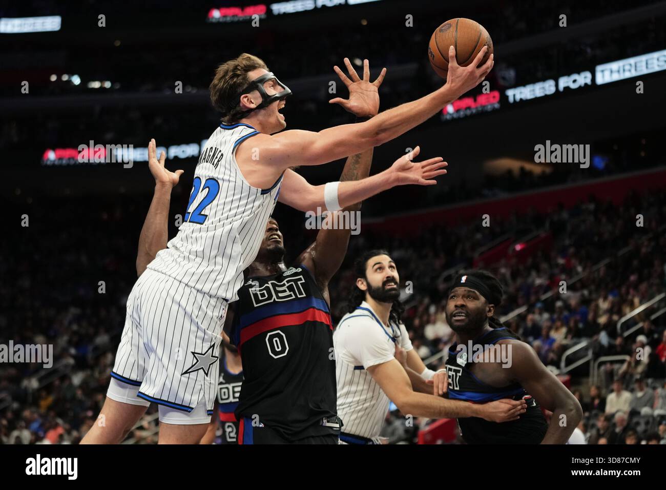 Orlando Magic forward Franz Wagner, left, shoots against Detroit ...