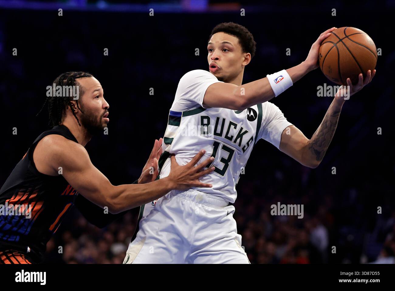 Milwaukee Bucks guard Ryan Rollins (13) looks to pass around New York ...