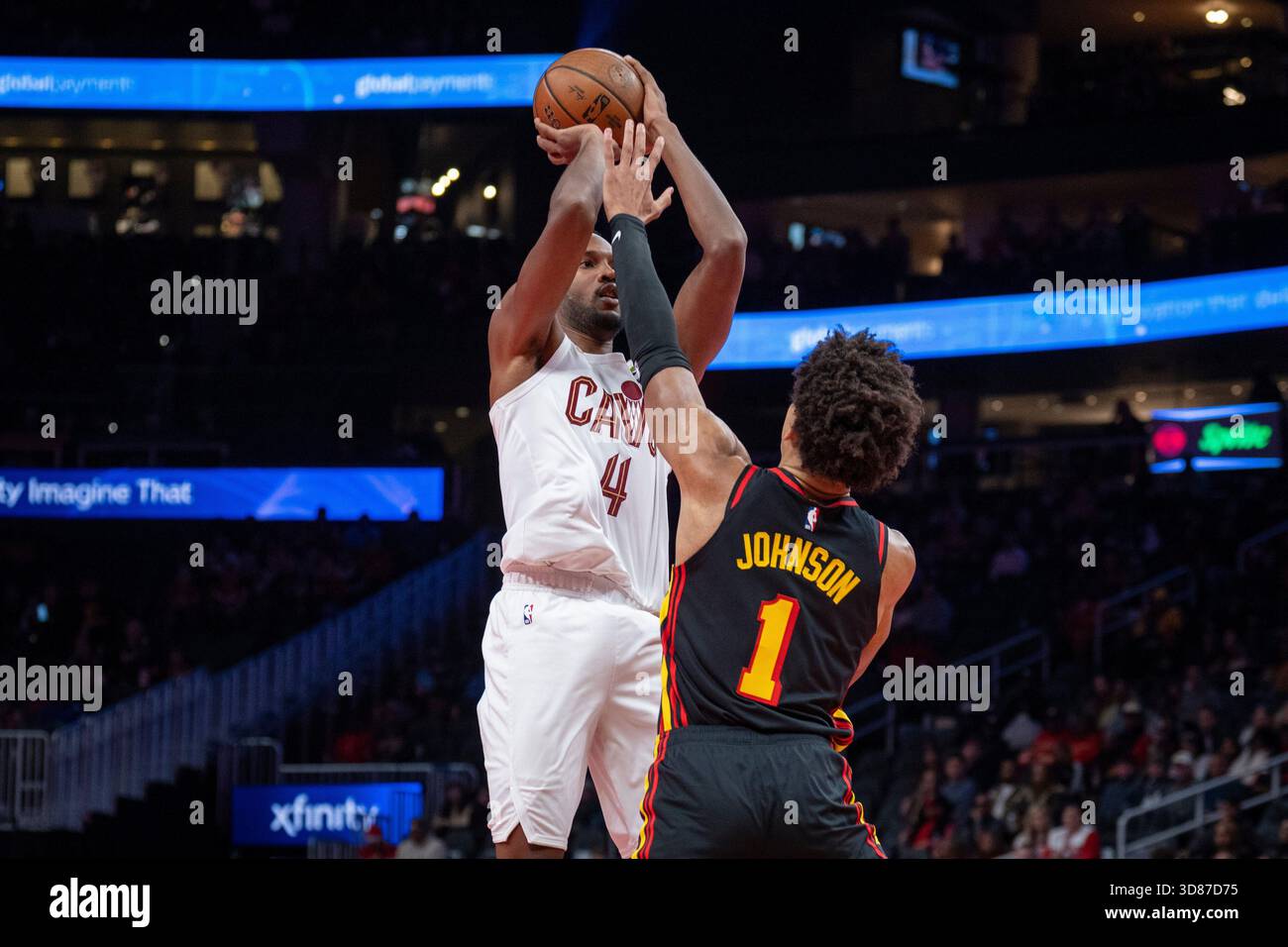 Cleveland Cavaliers center Evan Mobley (4), left, attempts a basket ...