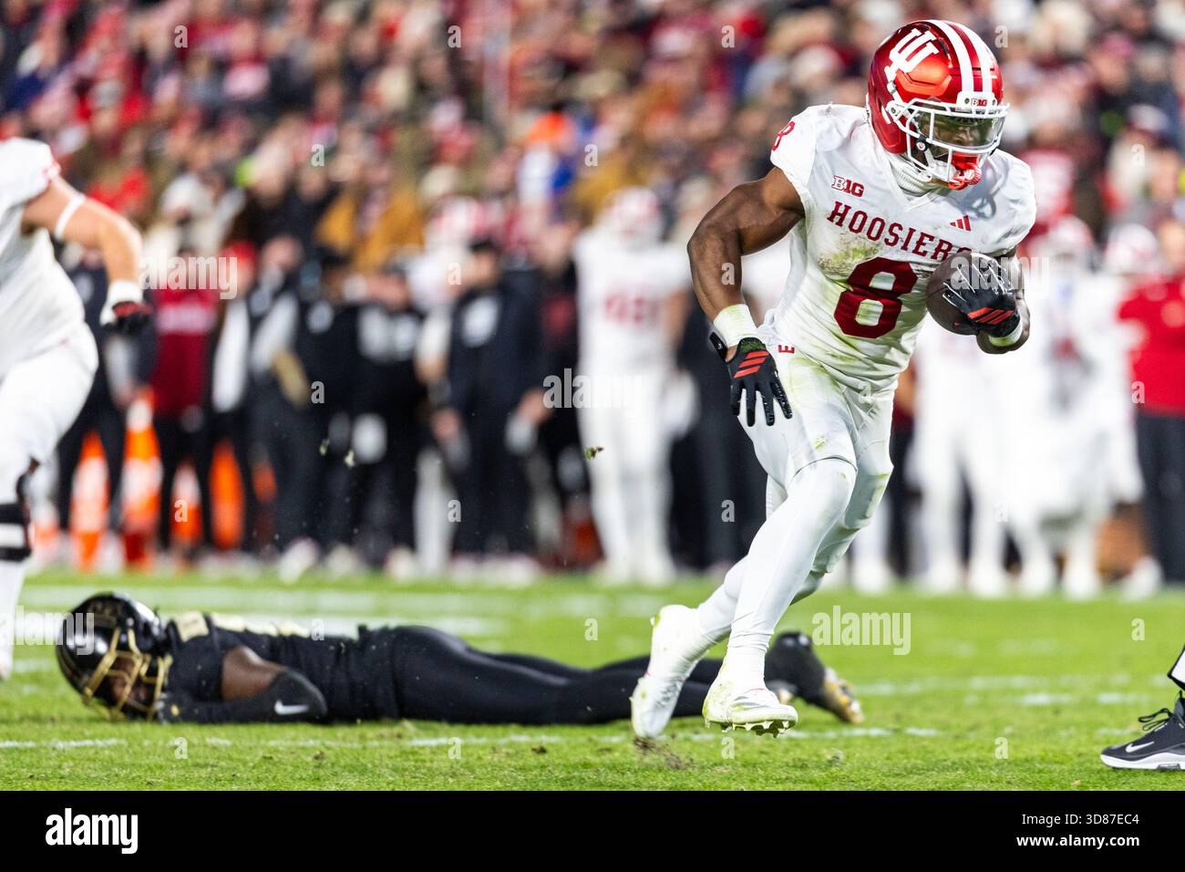 November 28, 2025: Indiana running back Kaelon Black (8) runs with the ...