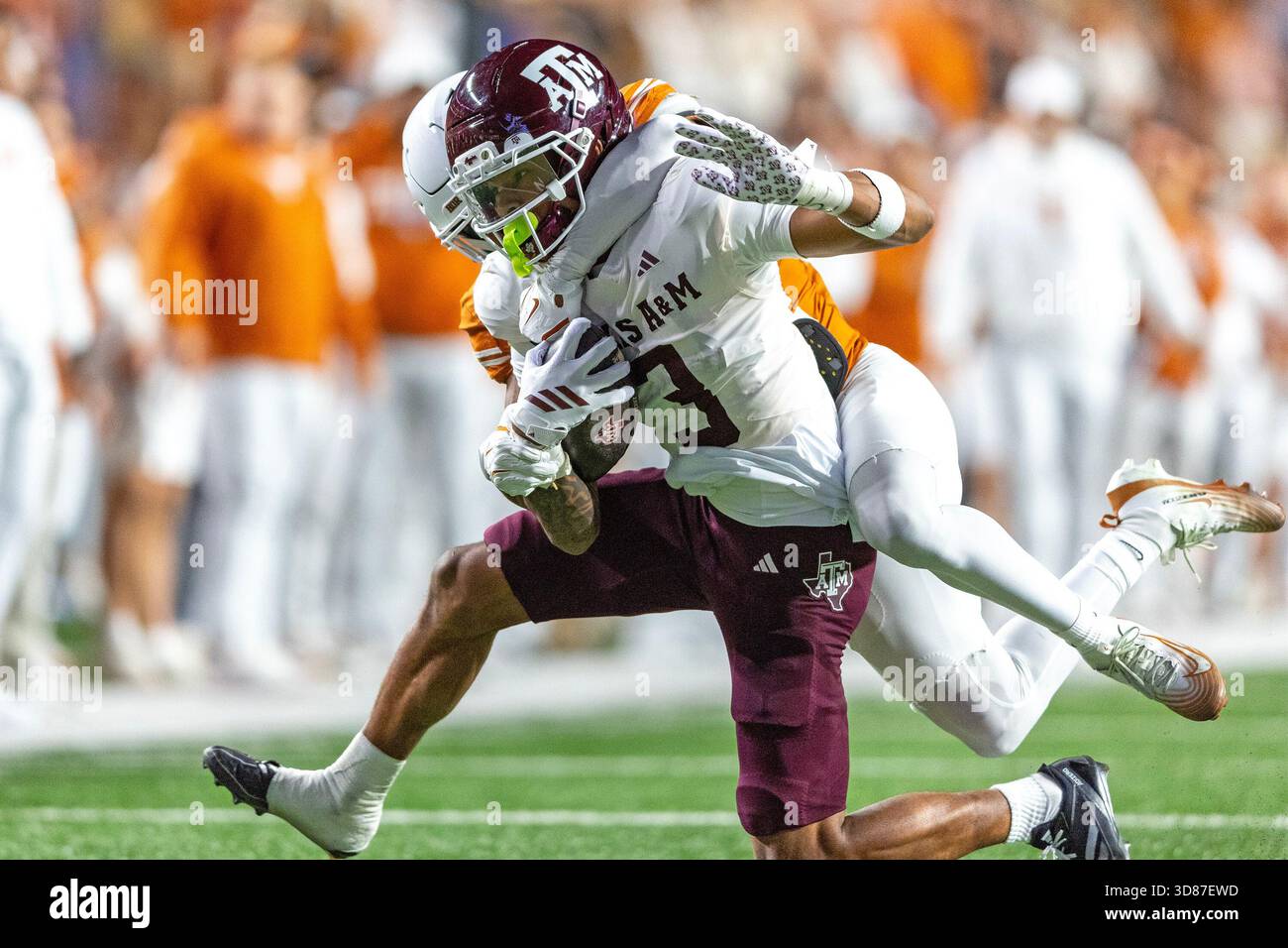 Texas A&M wide receiver Ashton Bethel-Roman (3) is pulled down by Texas ...