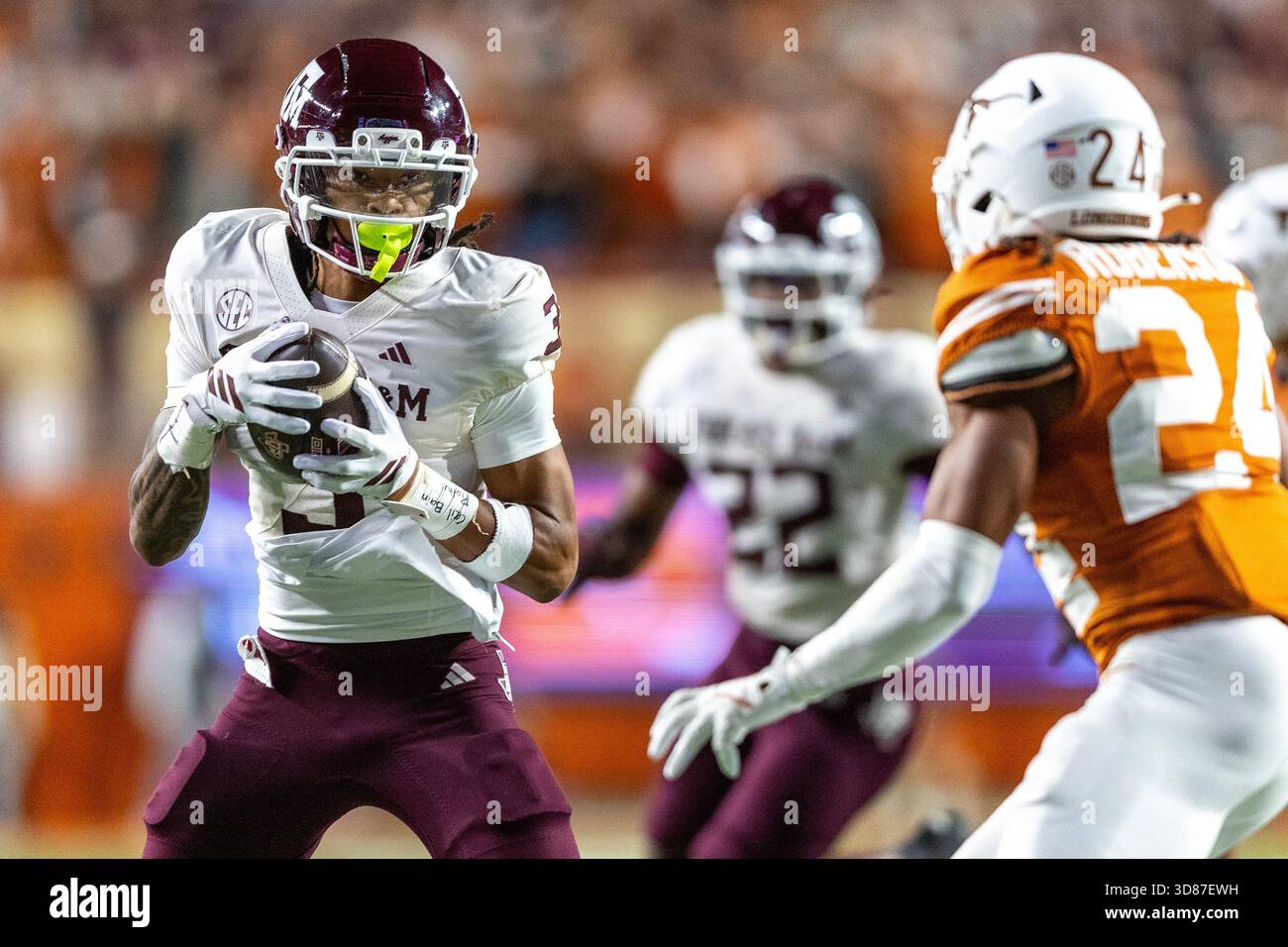 Texas A&M wide receiver Ashton Bethel-Roman, left, looks to get around ...