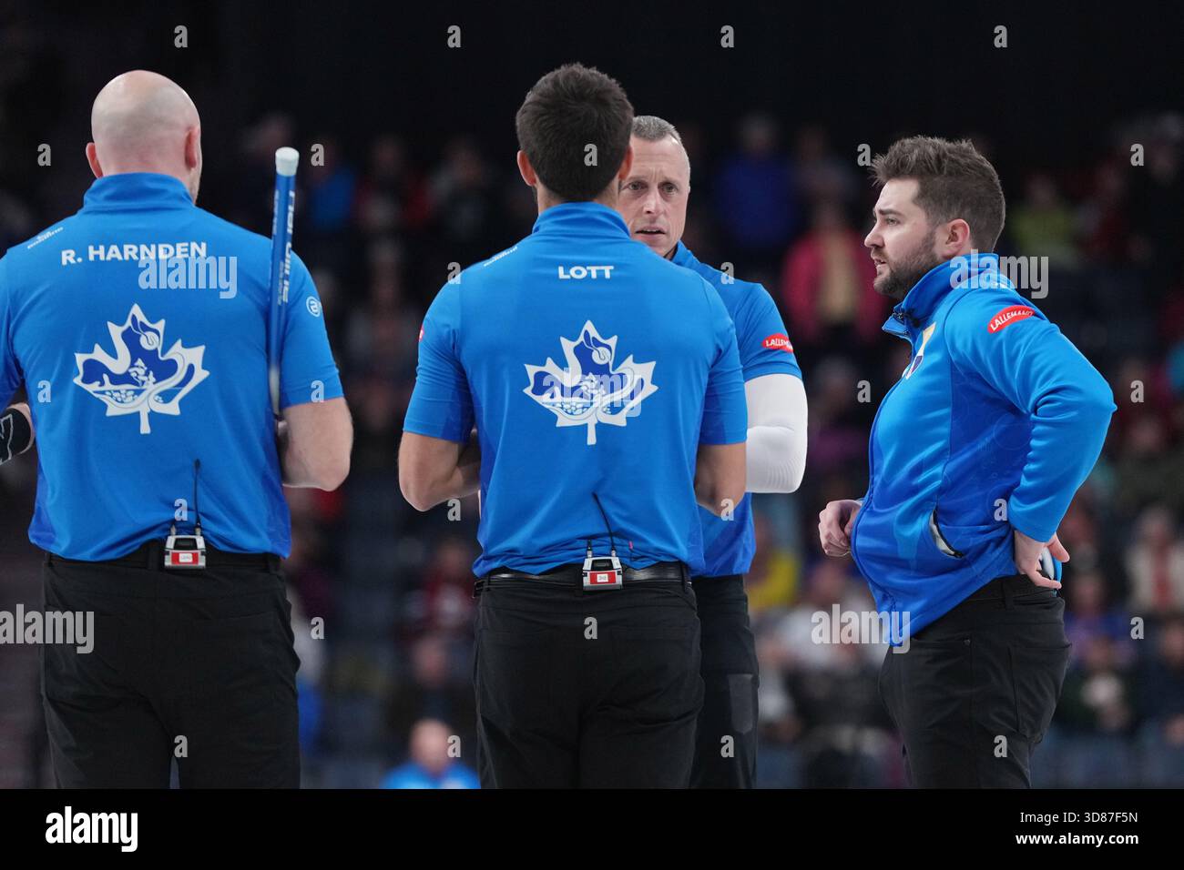 Team Dunstone skip Matt Dunstone, right, speaks with teammates, from ...