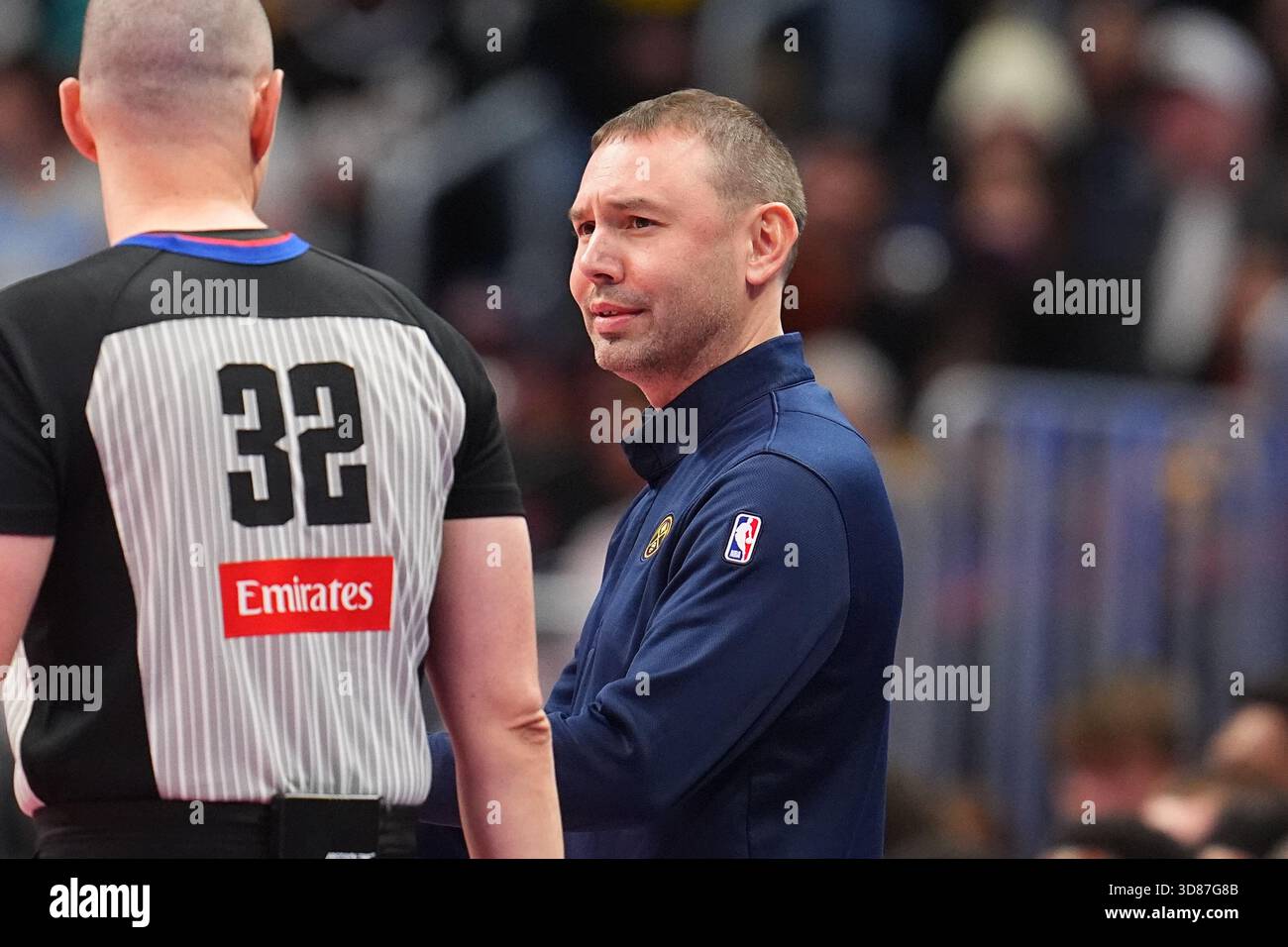 Denver Nuggets head coach David Adelman, right, confers with referee ...