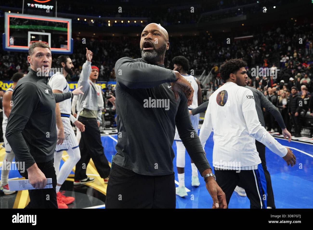 Orlando Magic head coach Jamahl Mosley, center, gestures after the team ...