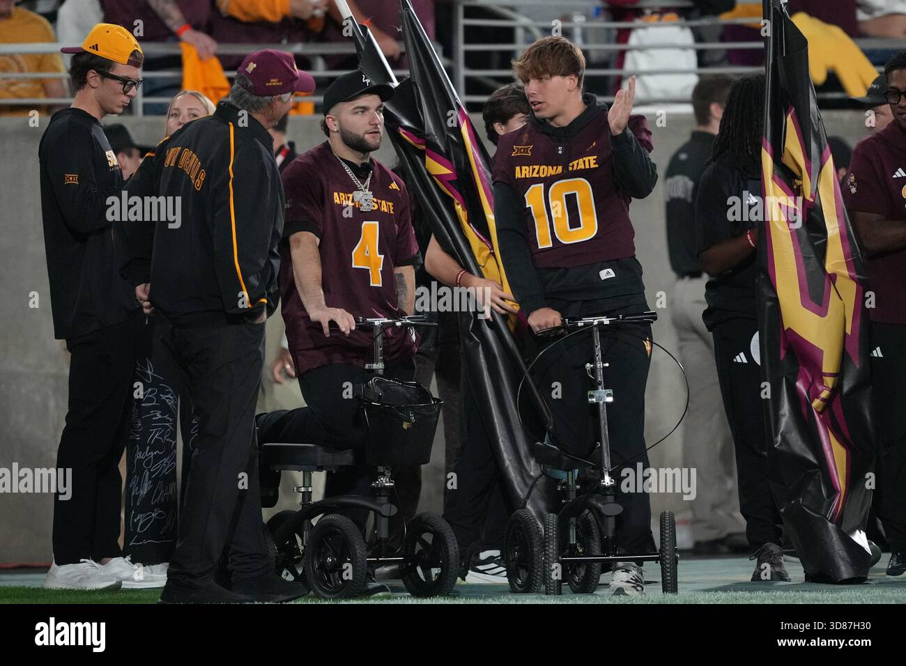 Cam Skattebo and Arizona State quarterback Sam Leavitt (10) watch from ...