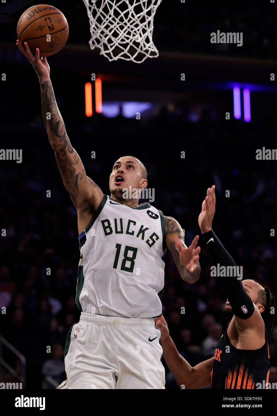 Milwaukee Bucks forward Kyle Kuzma (18) drives to the basket during NBA ...