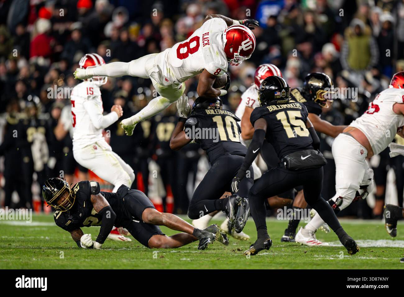 Indiana running back Kaelon Black (8) leaps over Purdue linebacker Alex ...