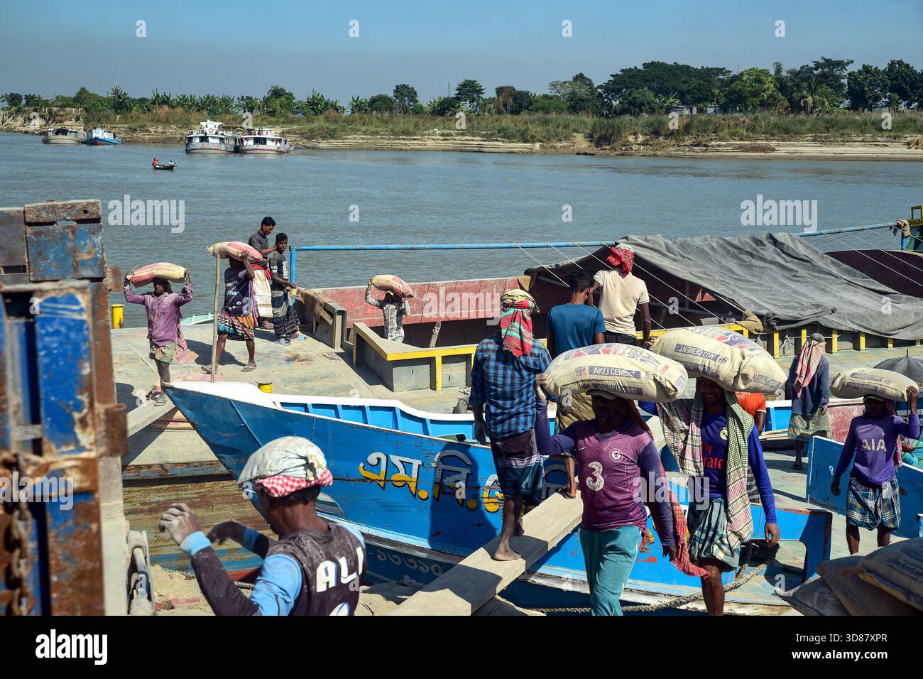 River Ferry Terminal Busy With Workers Carrying Sacks and Boarding ...
