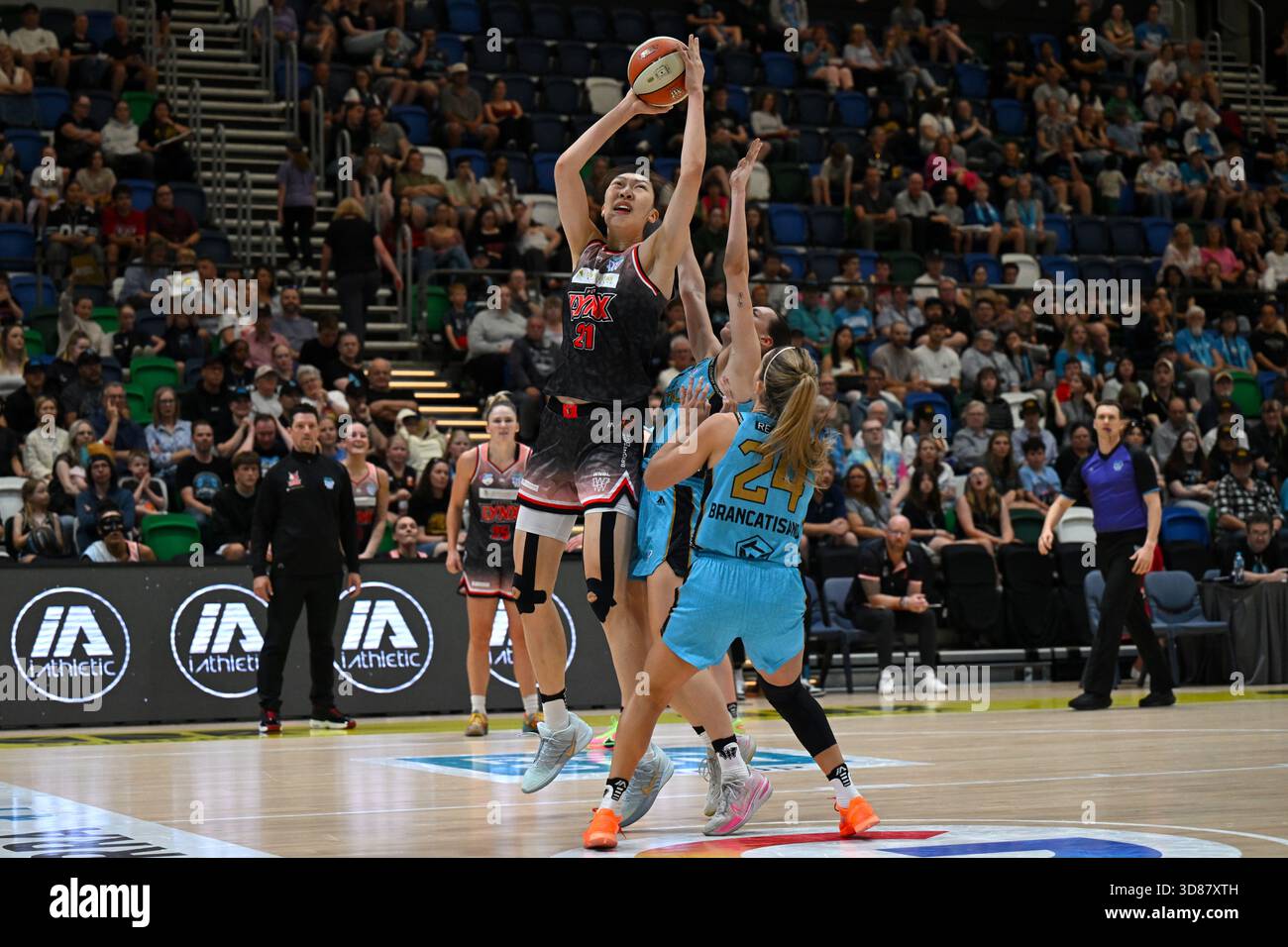 Han Xu of Perth Lynx is challenged by Isabella Brancatisano of the ...