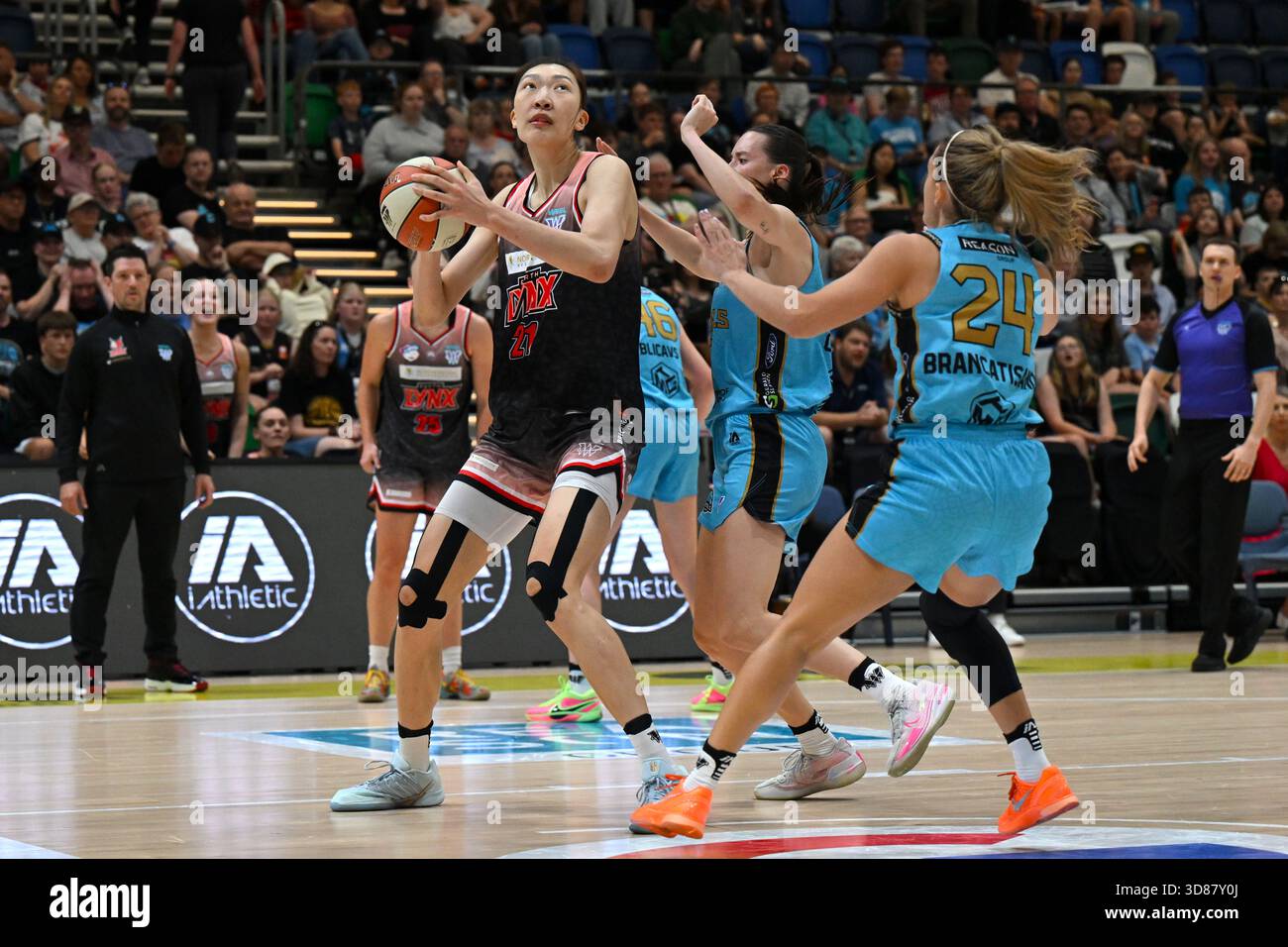 Han Xu of Perth Lynx is challenged by Isabella Brancatisano of the ...