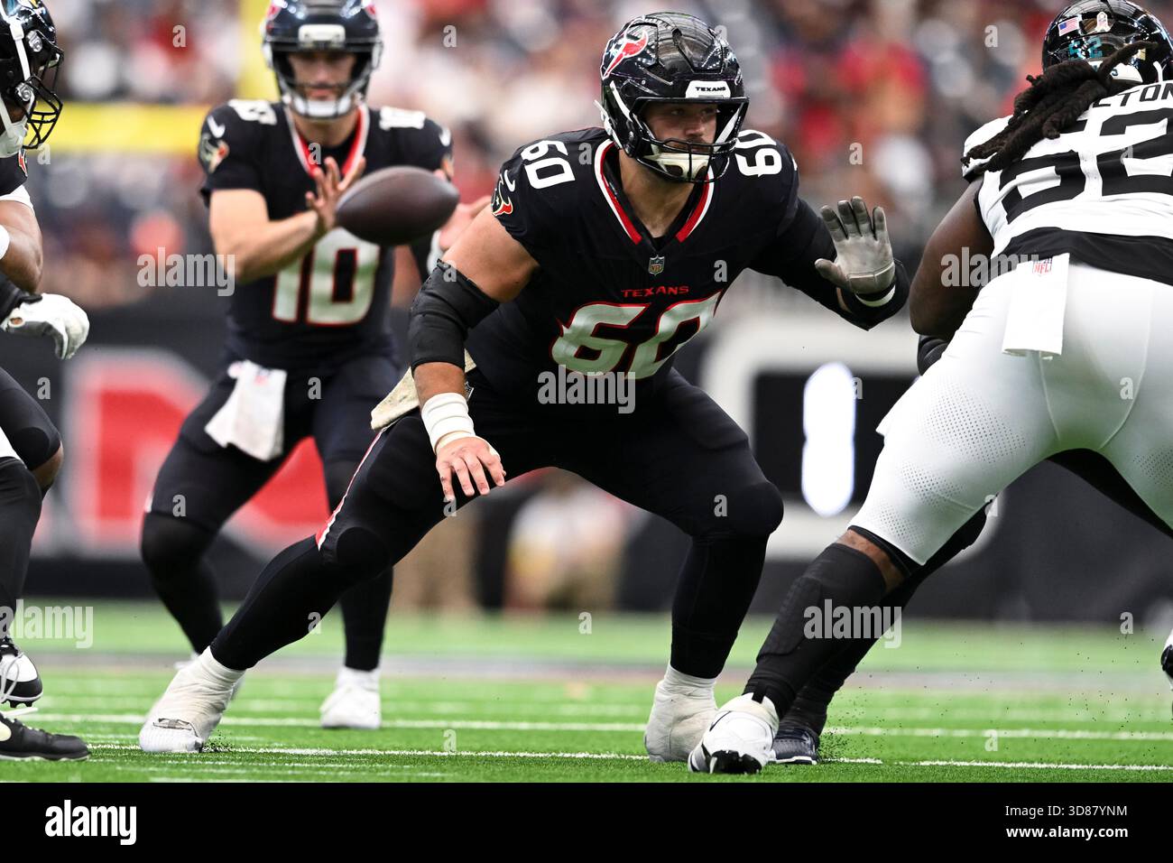 Houston Texans center Jake Andrews (60) blocks during the second half ...
