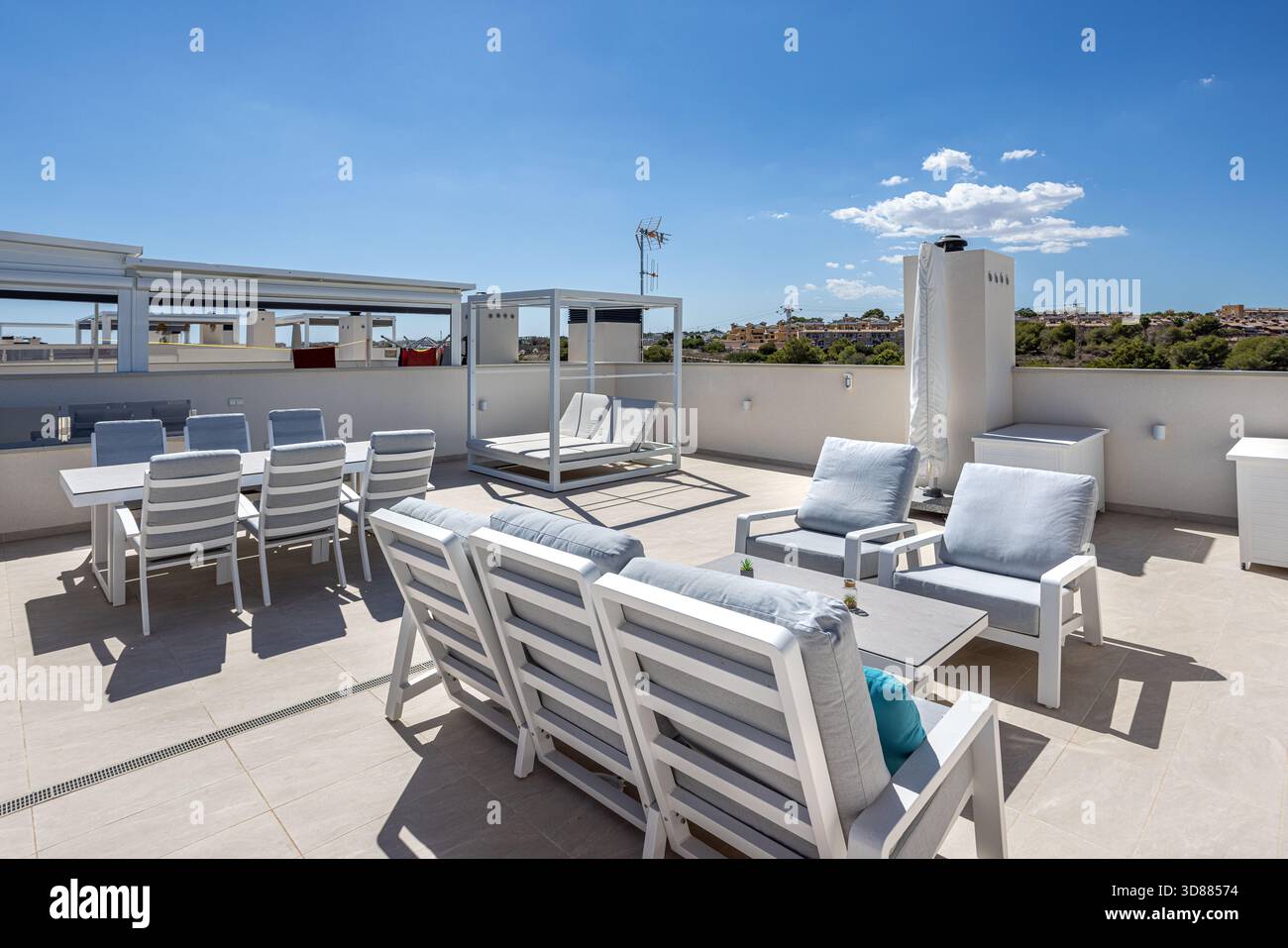 Modern rooftop terrace with lounge seating, dining area, and canopy ...