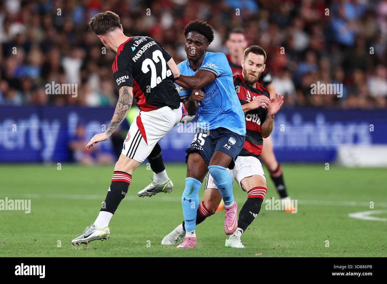 Anthony Pantazopoulos of the Wanderers and Al Hassan Toure compete for ...