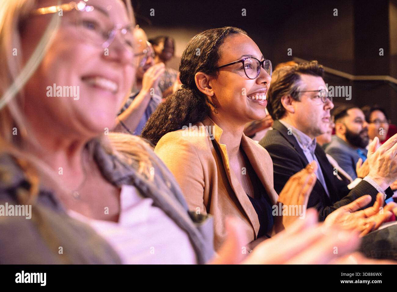 Woman clapping hands smiling wearing hi-res stock photography and ...