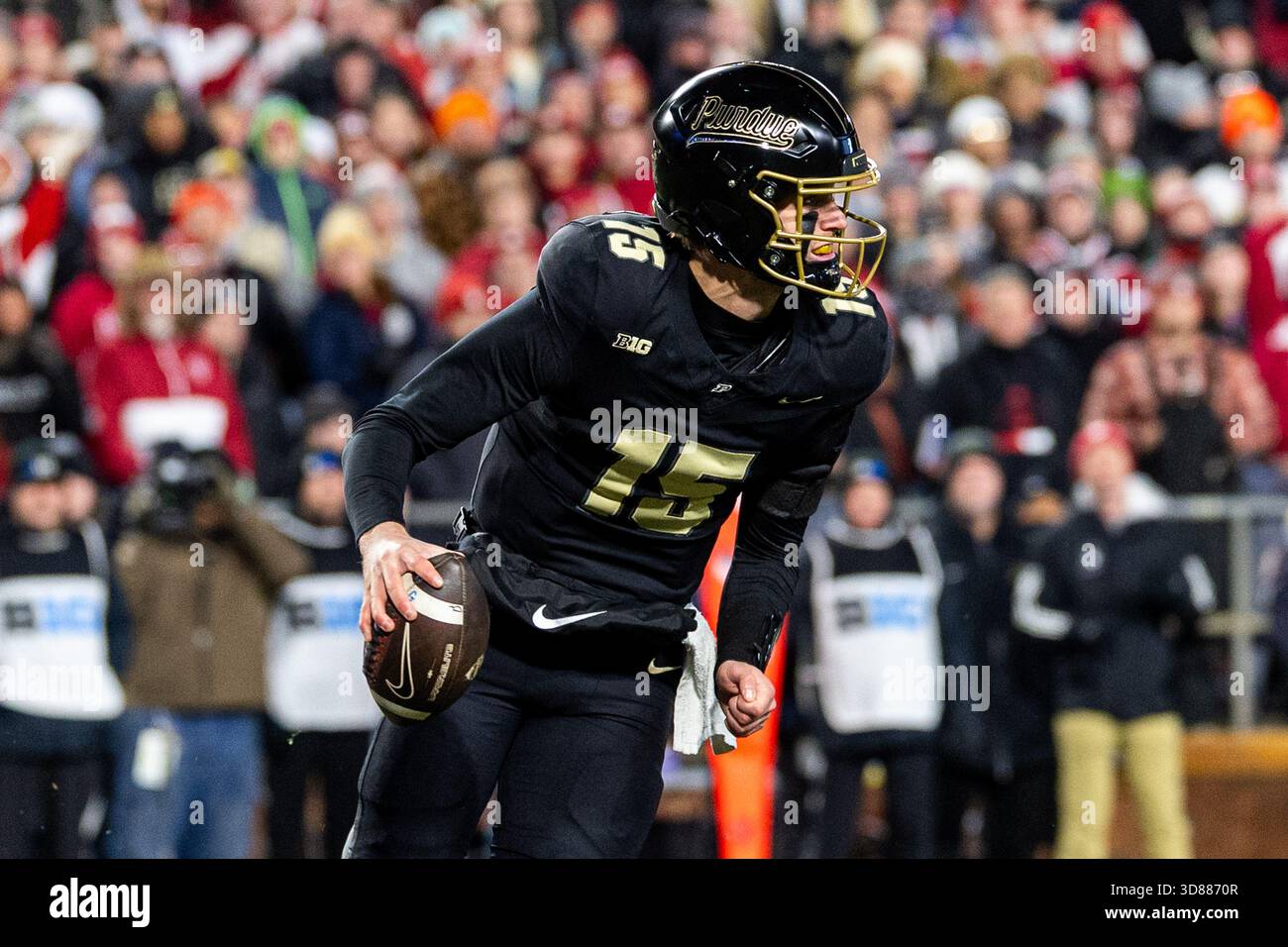 November 28, 2025: Purdue quarterback Ryan Browne (15) rolls out of the ...