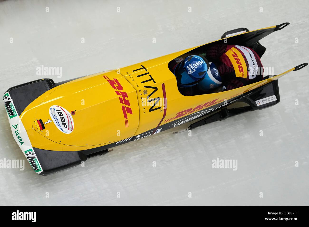Johannes Lochner and Georg Fleischhauer of Germany speed down the track ...