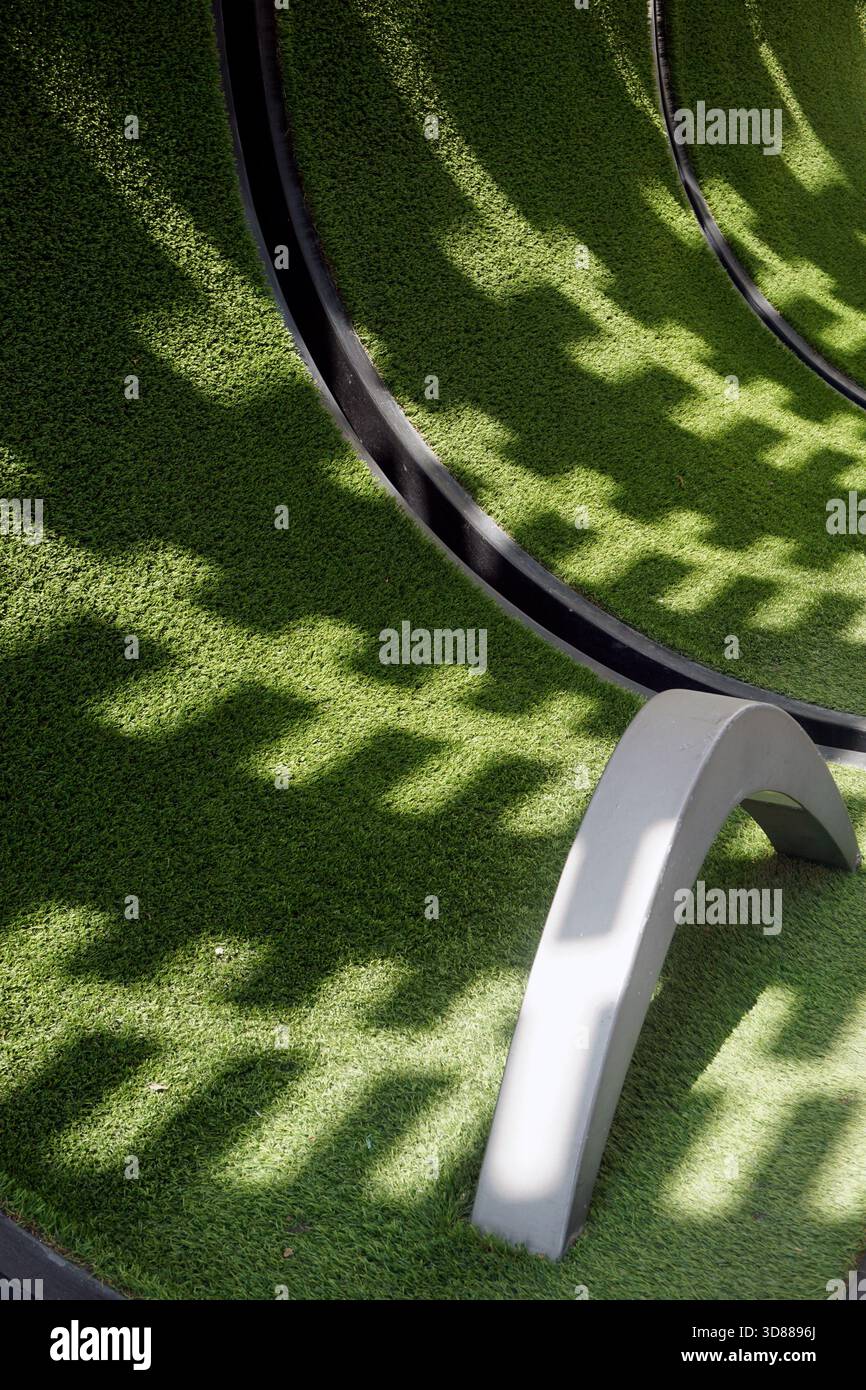 abstract curved grass wall with shadowsgrowing on hotel building doha ...