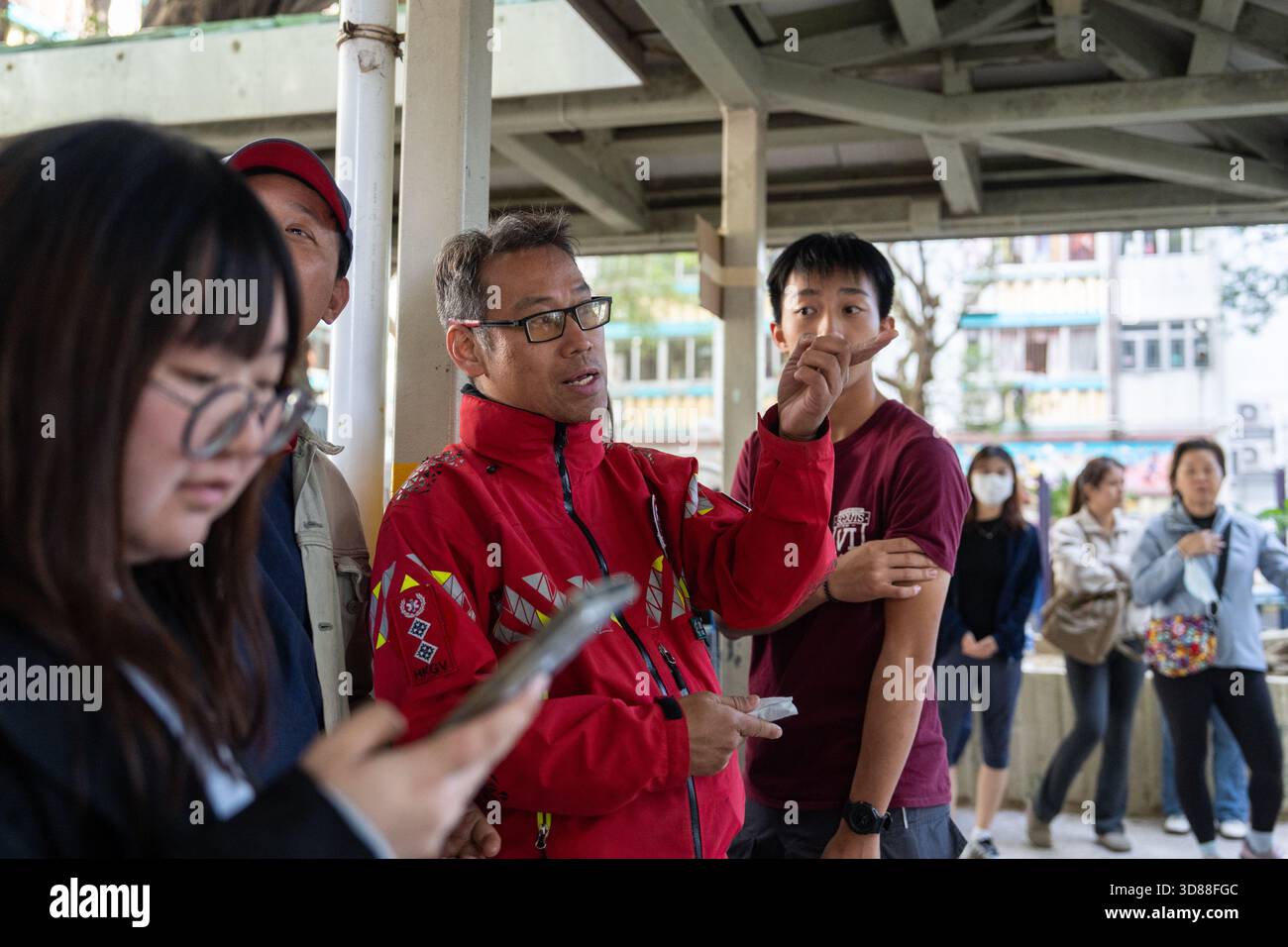 Anson Cheng from The Hong Kong Guardians works near the scene of the ...