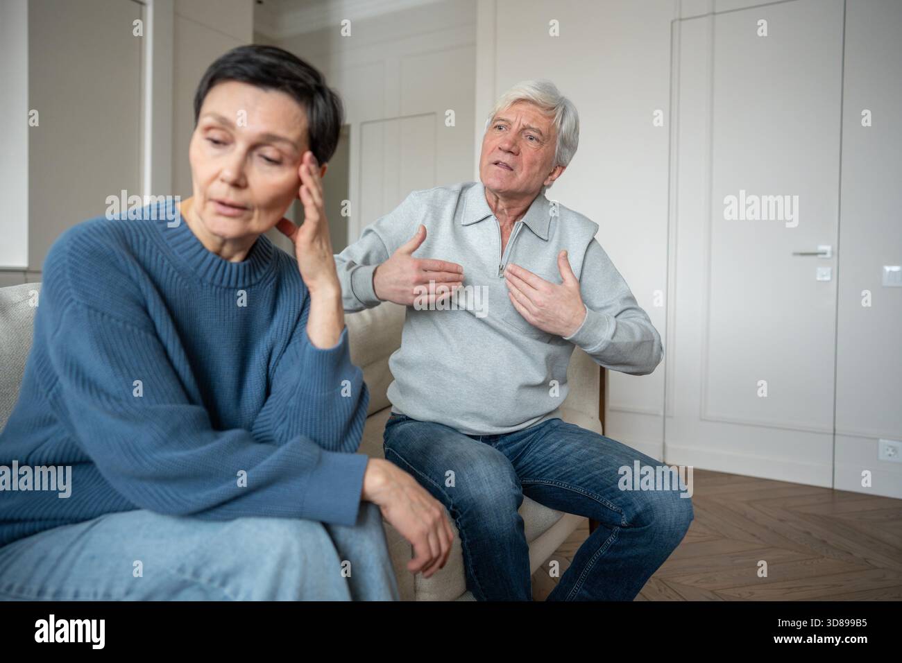 Distressed senior woman enduring verbal aggression from neurotic ...