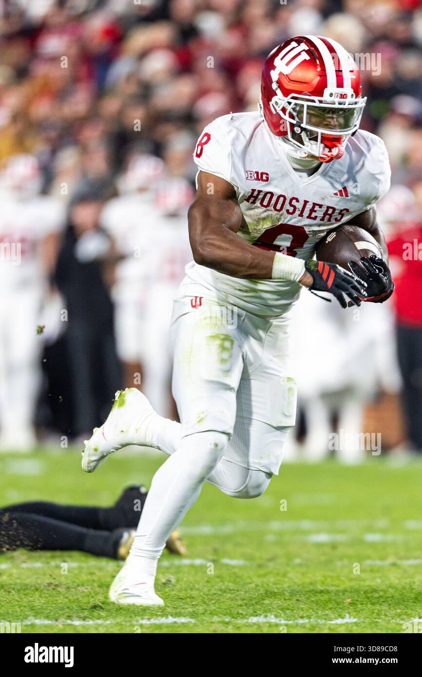 November 28, 2025: Indiana running back Kaelon Black (8) runs with the ...